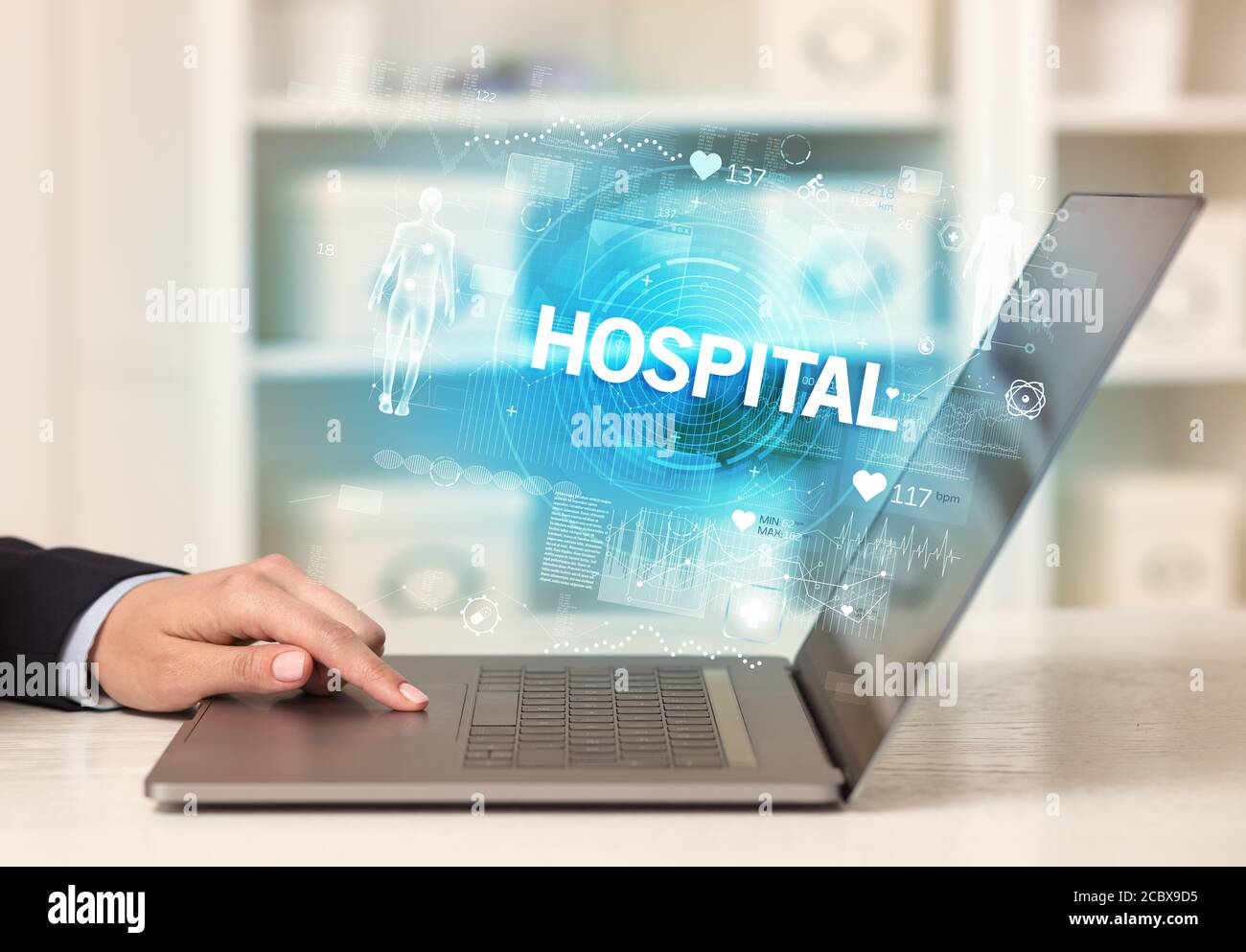 Doctor working a health check with HOSPITAL inscription, recording ...
