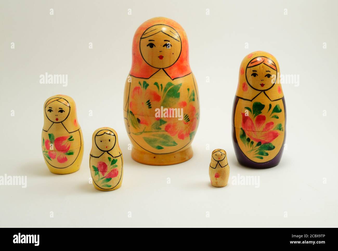 five traditional Russian nesting dolls on white background Stock Photo ...