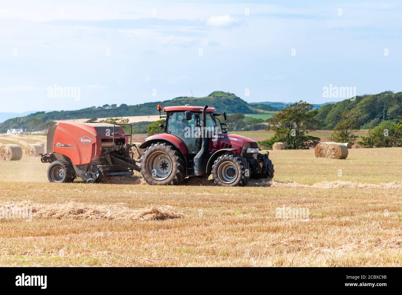 West Kilbride, Scotland, UK. 16th August 2020. A tractor towing a hay ...