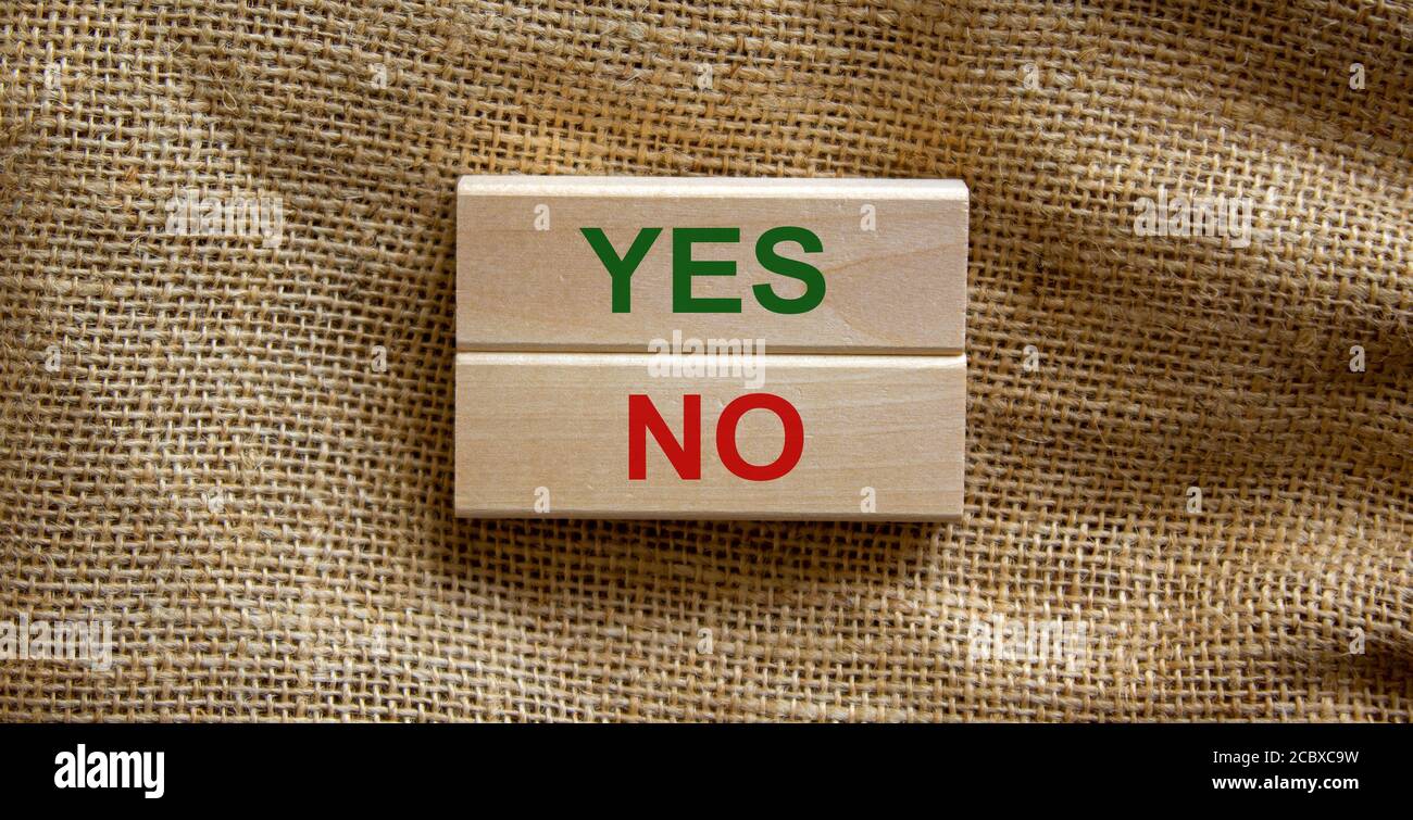 Wood blocks with words 'yes, no' on beautiful canvas background, copy ...