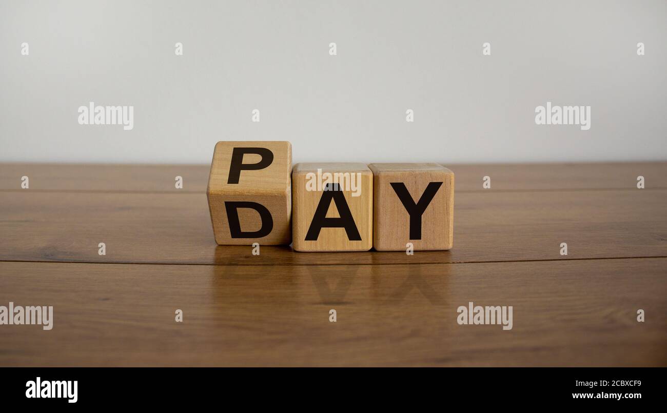 Turned a cube and changed the word 'Pay' to 'Day'. Beautiful wooden ...