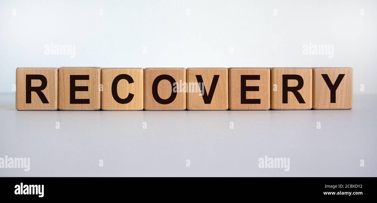 Concept word 'recovery' on cubes on a beautiful white background ...