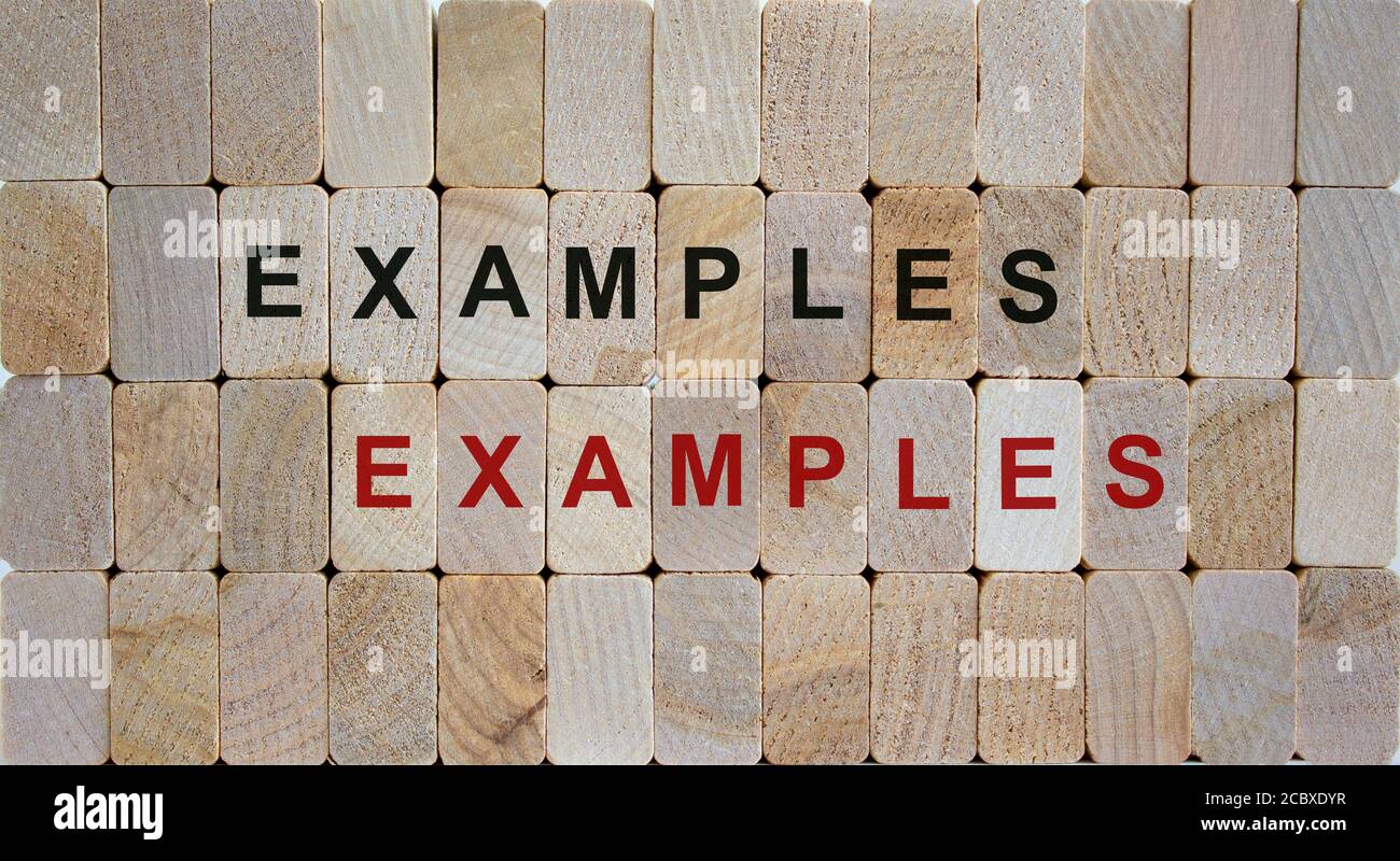 Wooden blocks form the words 'examples, examples'. Beautiful wooden ...