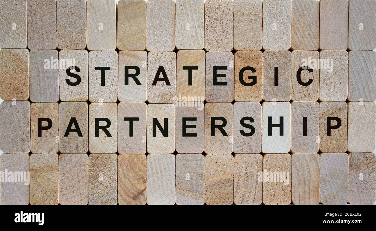 Wooden blocks form the words 'strategic partnership'. Beautiful wooden ...