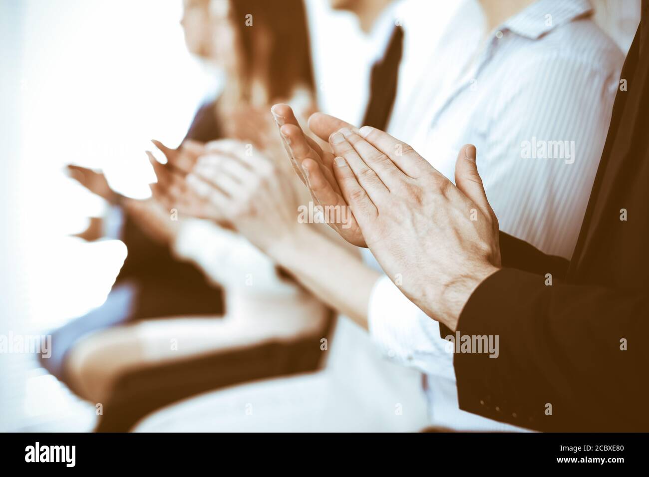 Business people clapping and applause at meeting or conference, close ...
