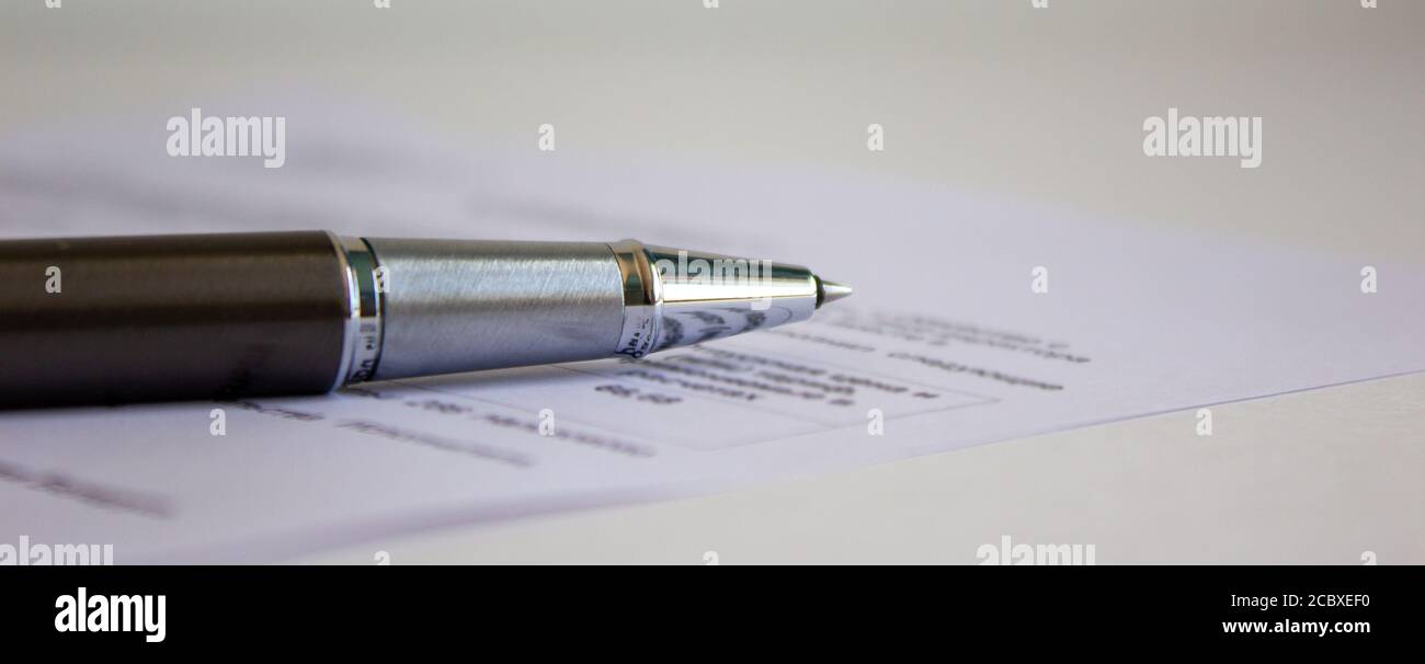 Document and pen on beautiful white table. Concept background Stock ...
