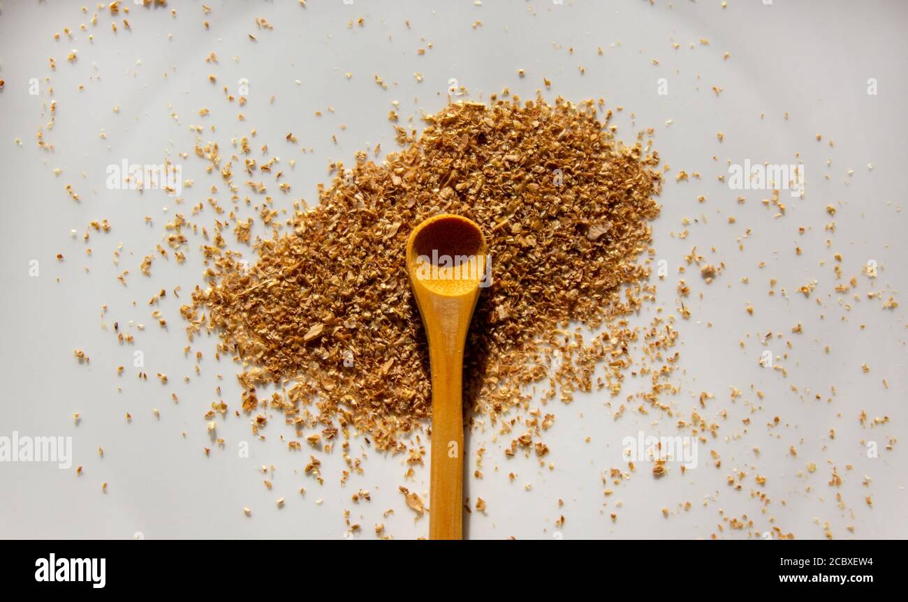 Wooden spoon and spicy composition isolated over the white background ...