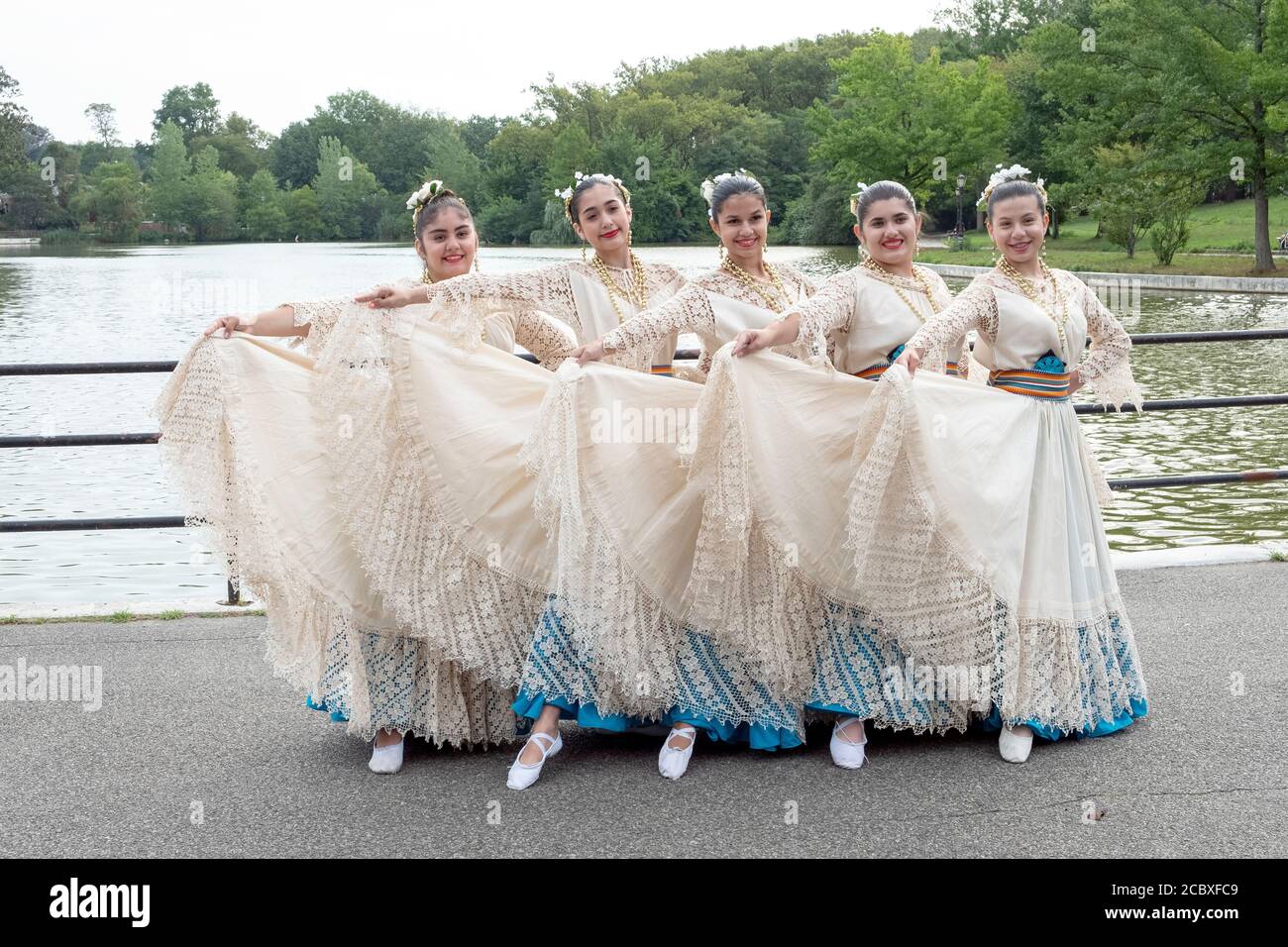 Posed portrait of a group of Paraguayan American folk dancers in native ...