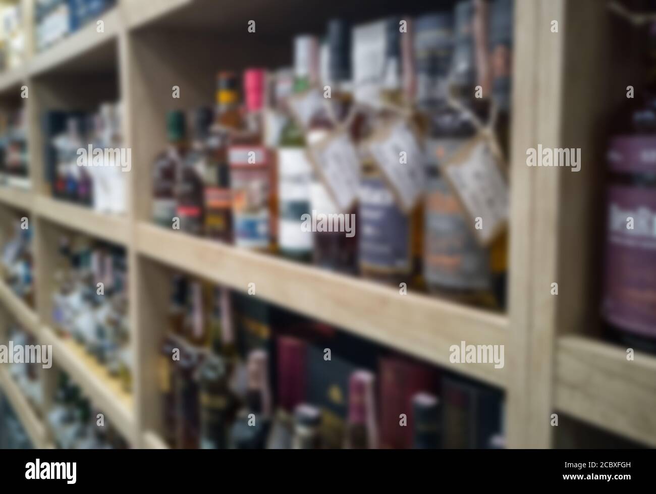 Blurred abstract background of shelf in supermarket. Alcohol showcase ...