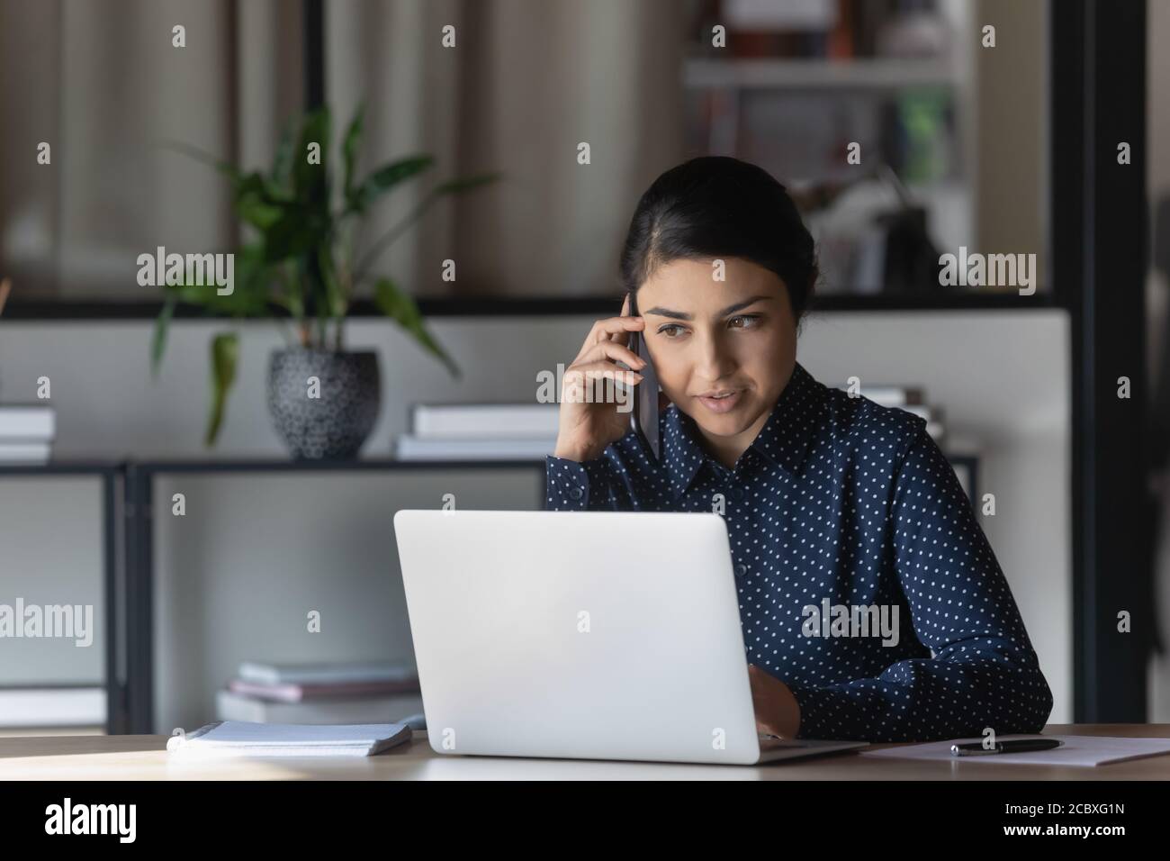 Happy young indian ethnic businesswoman holding mobile phone call Stock ...