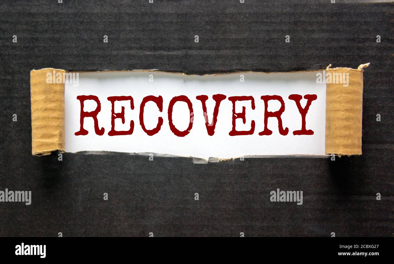 The word 'recovery' appearing behind torn black paper. Beautiful ...