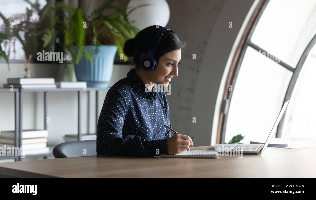 Happy indian businesswoman consulting clients by video call Stock Photo ...