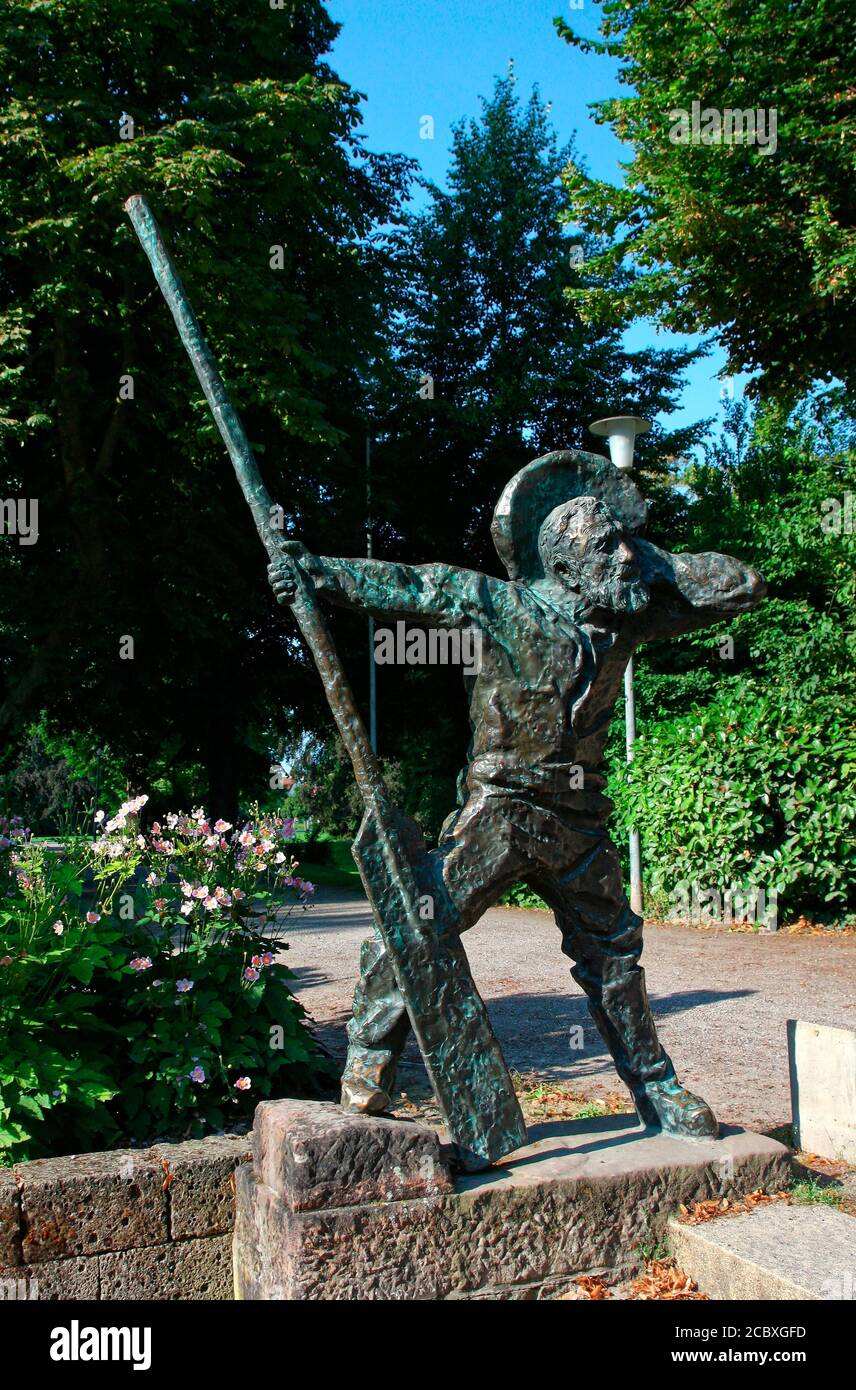 statue; ferry man with oar oar; listening to royalty calling; part of ...