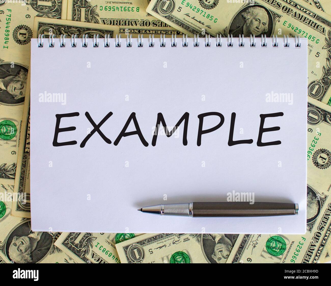 White note with inscription 'example' on beautiful background from ...