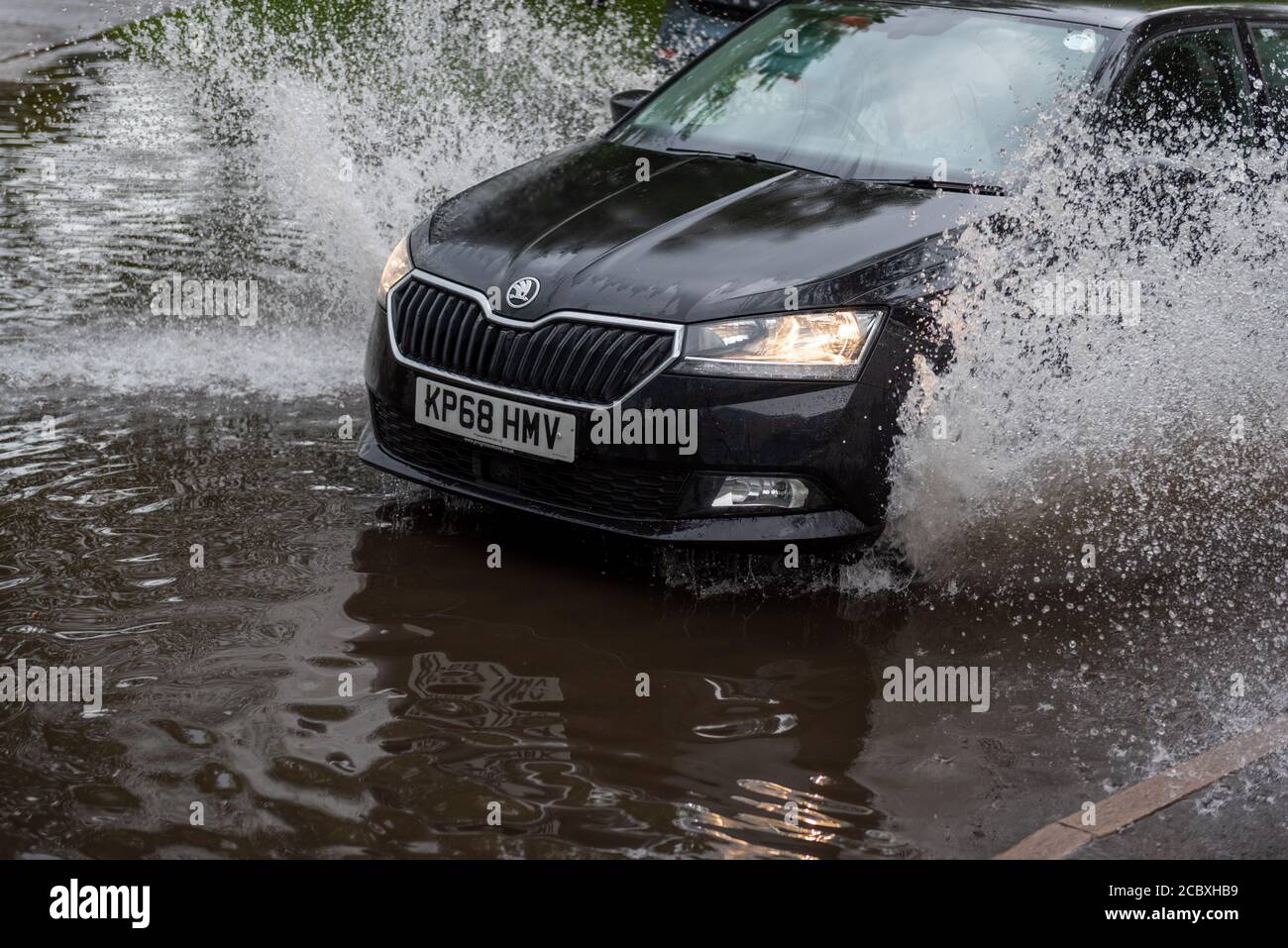 A car driving through flood water hi-res stock photography and images ...