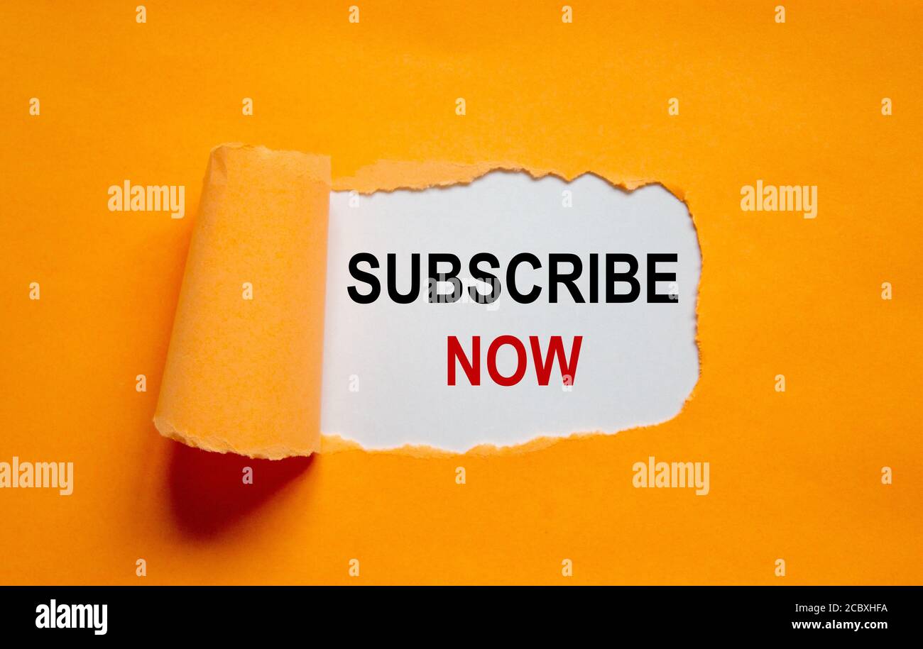 The words 'subscribe now' appearing behind torn orange paper. Business ...