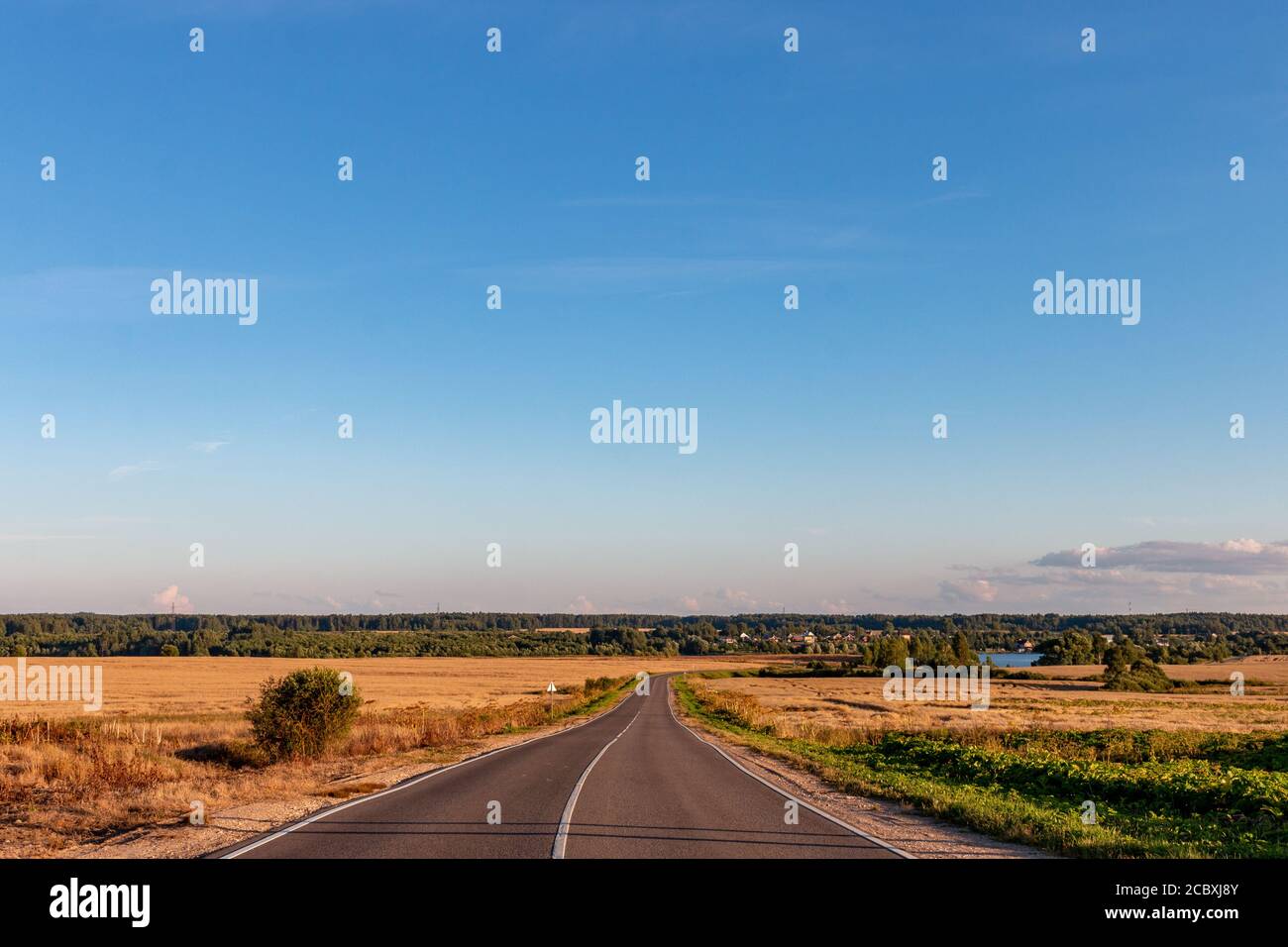 Scenic road through the fields. Russian road Stock Photo - Alamy