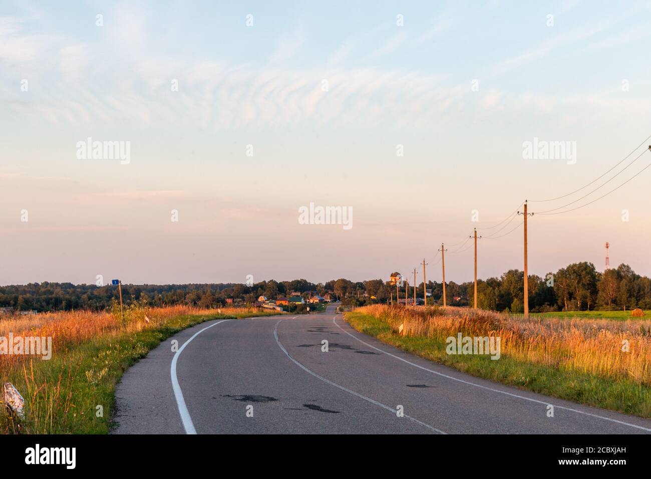 Scenic road through the fields. Russian road Stock Photo - Alamy