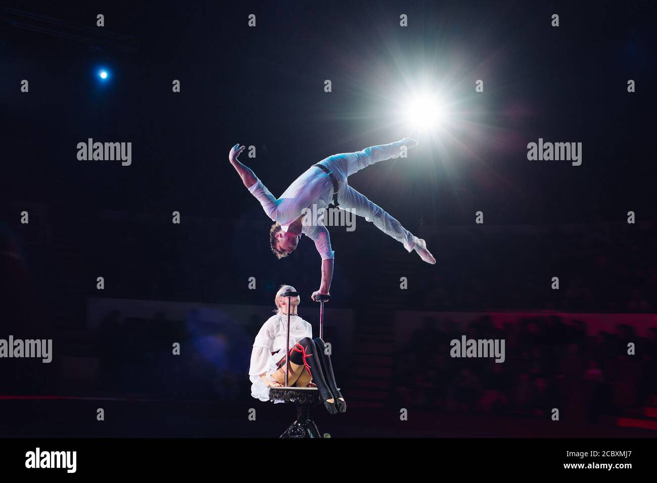 Man's aerial acrobatics in the Circus. Circus performance Stock Photo ...