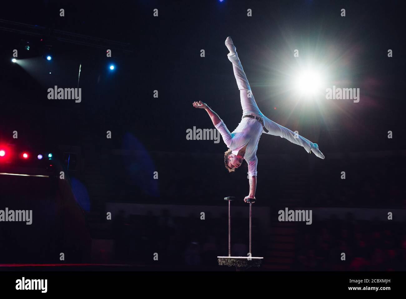 Man's aerial acrobatics in the Circus. Circus performance Stock Photo ...