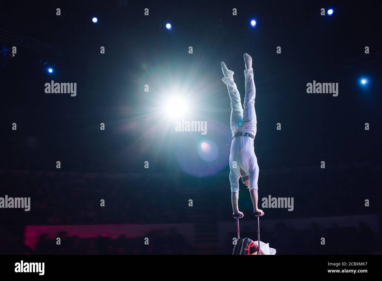 Man's aerial acrobatics in the Circus. Circus performance Stock Photo ...