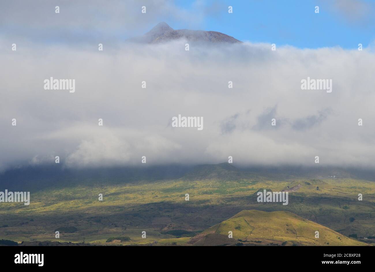 The conical Pico volcano looming over its namesake island, Azores ...