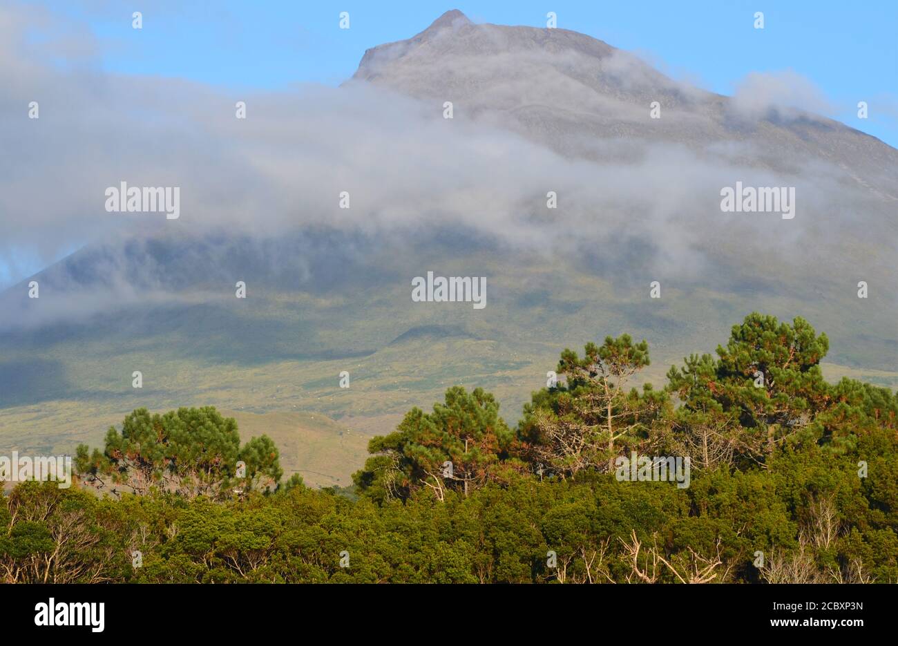 The conical Pico volcano looming over its namesake island, Azores ...