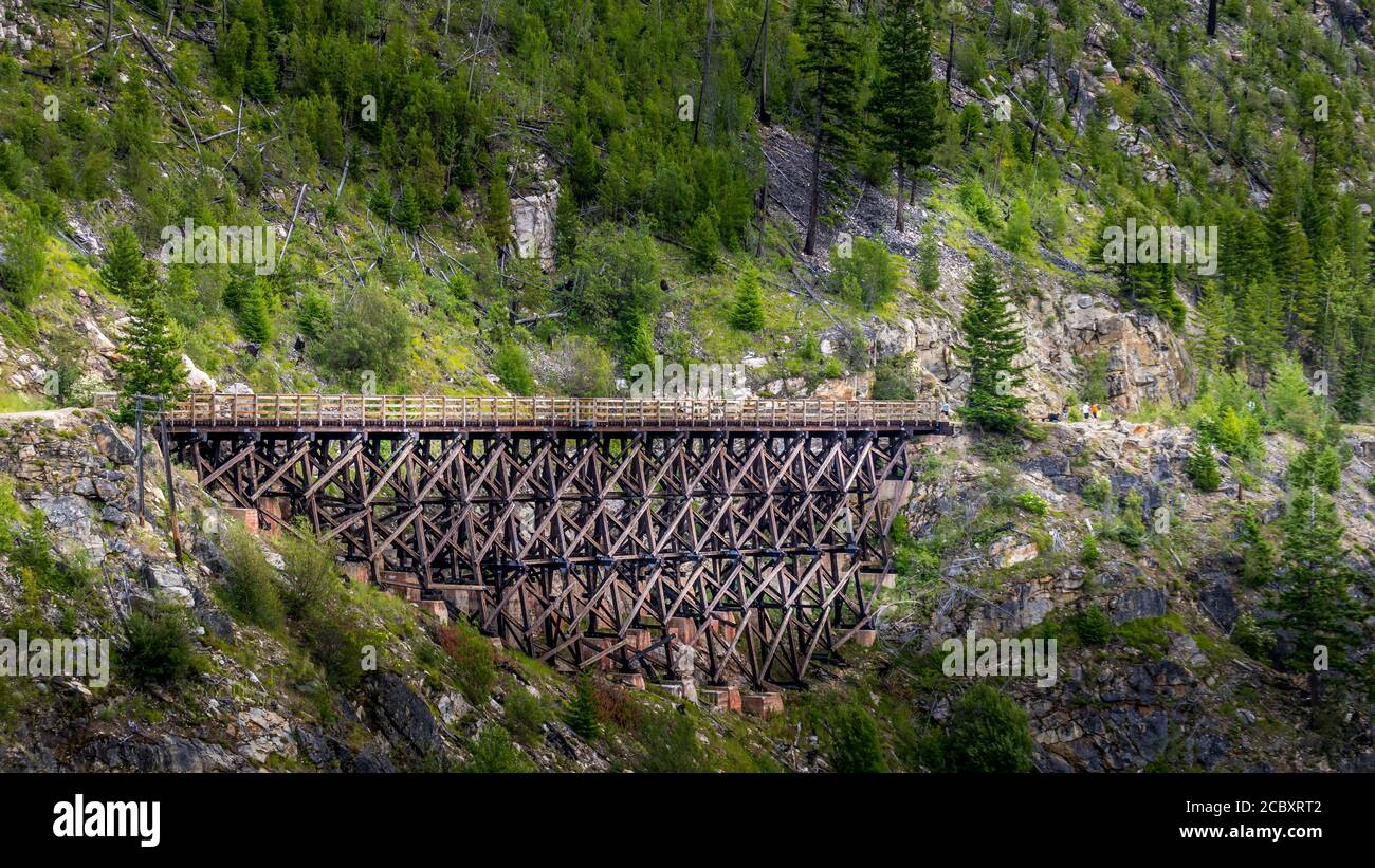 One of the 18 Wooden Trestle Bridges of the abandoned Kettle Valley Railway in Myra Canyon near ...