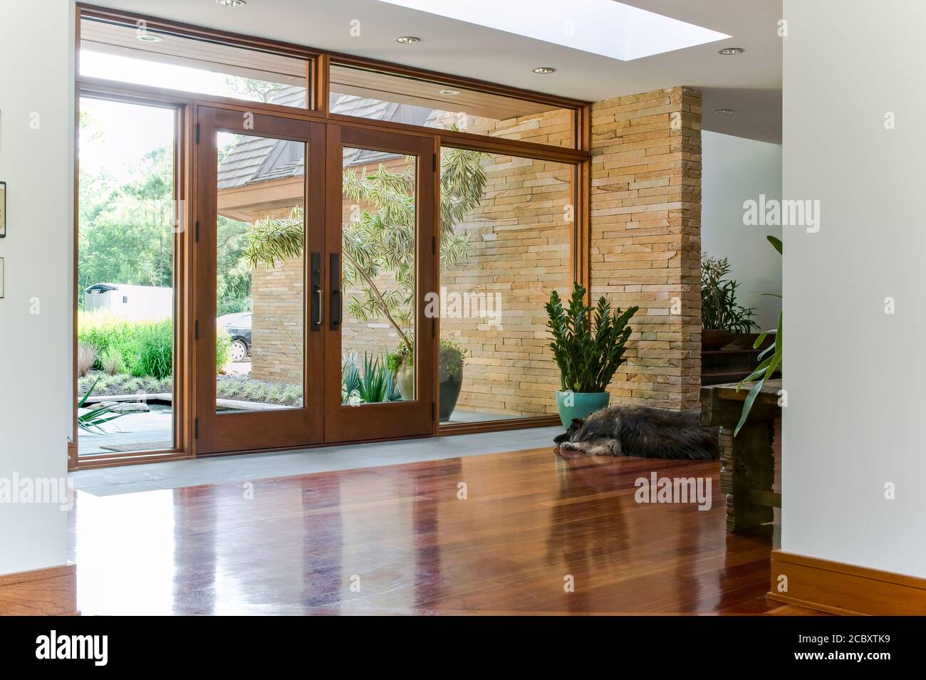 Modern Foyer with French glass doors Stock Photo - Alamy