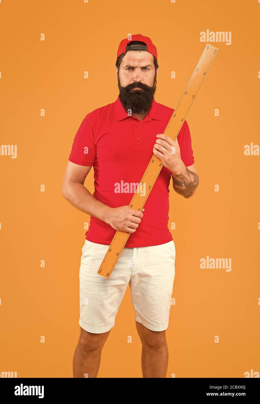 brutal service worker with ruler. measure the length. Measuring a line ...