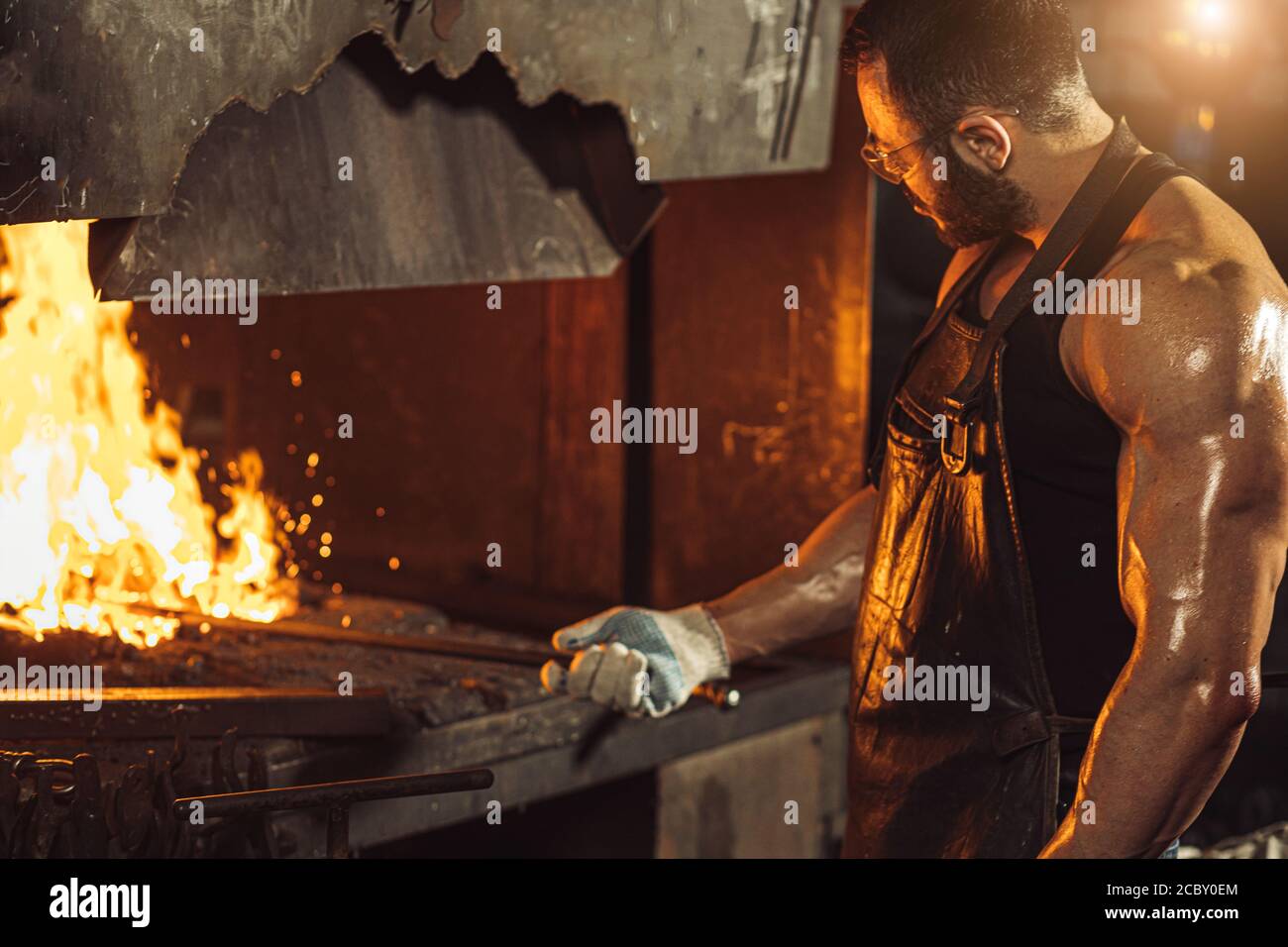 Boy forging with blacksmith hi-res stock photography and images - Alamy
