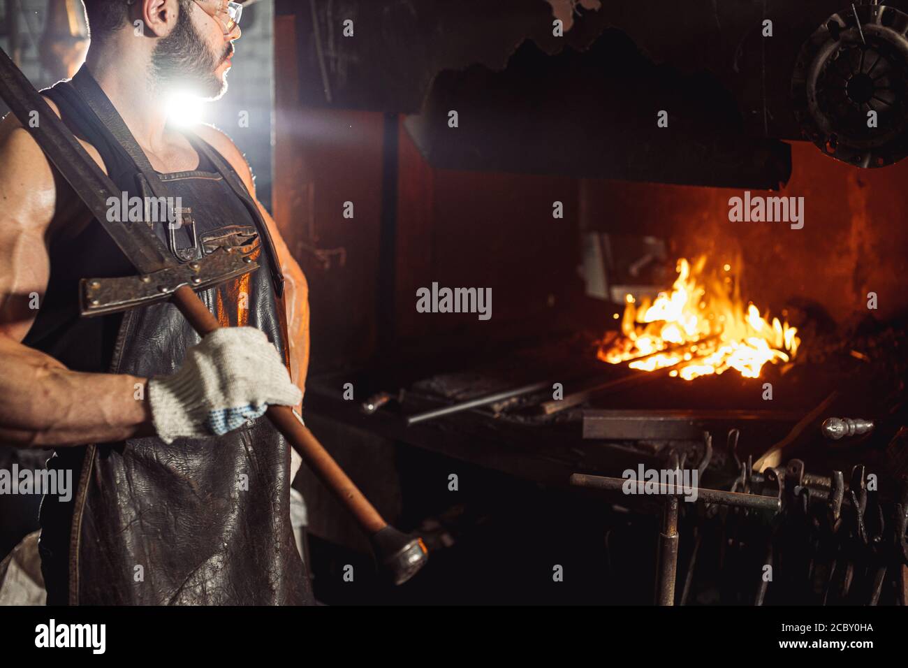 handsome muscular male blacksmith holding handmade metal for ...