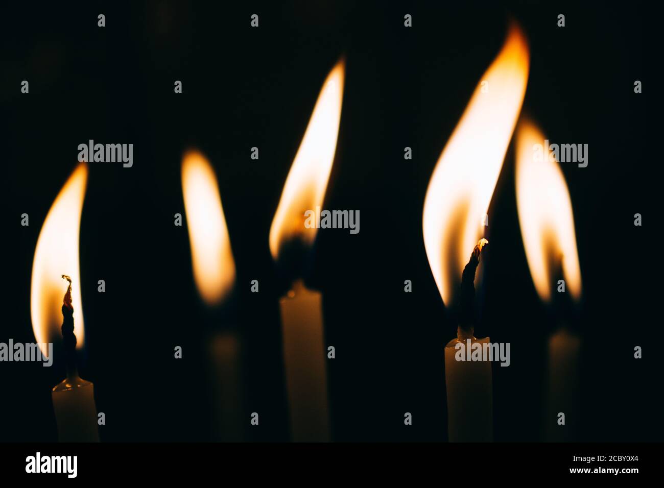 Candle lights in the darkness. Abstract candles background. Hope, fire ...