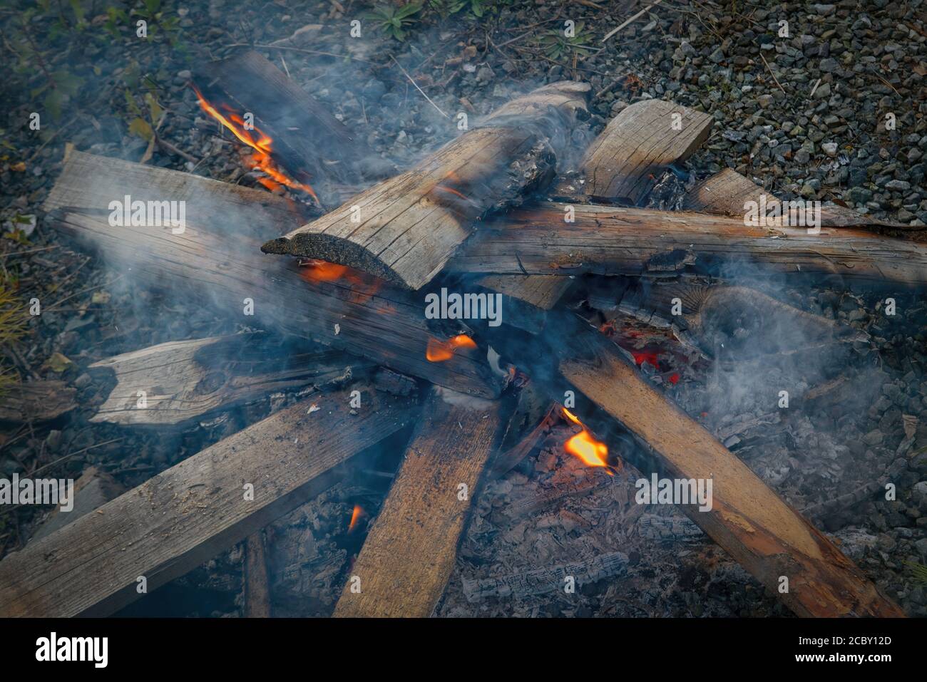 Burning log of wood close-up as abstract background. The hot embers of ...