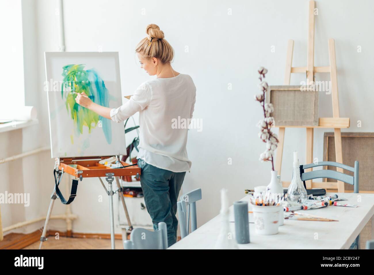 Beautiful blonde woman painter in hi-res stock photography and images ...