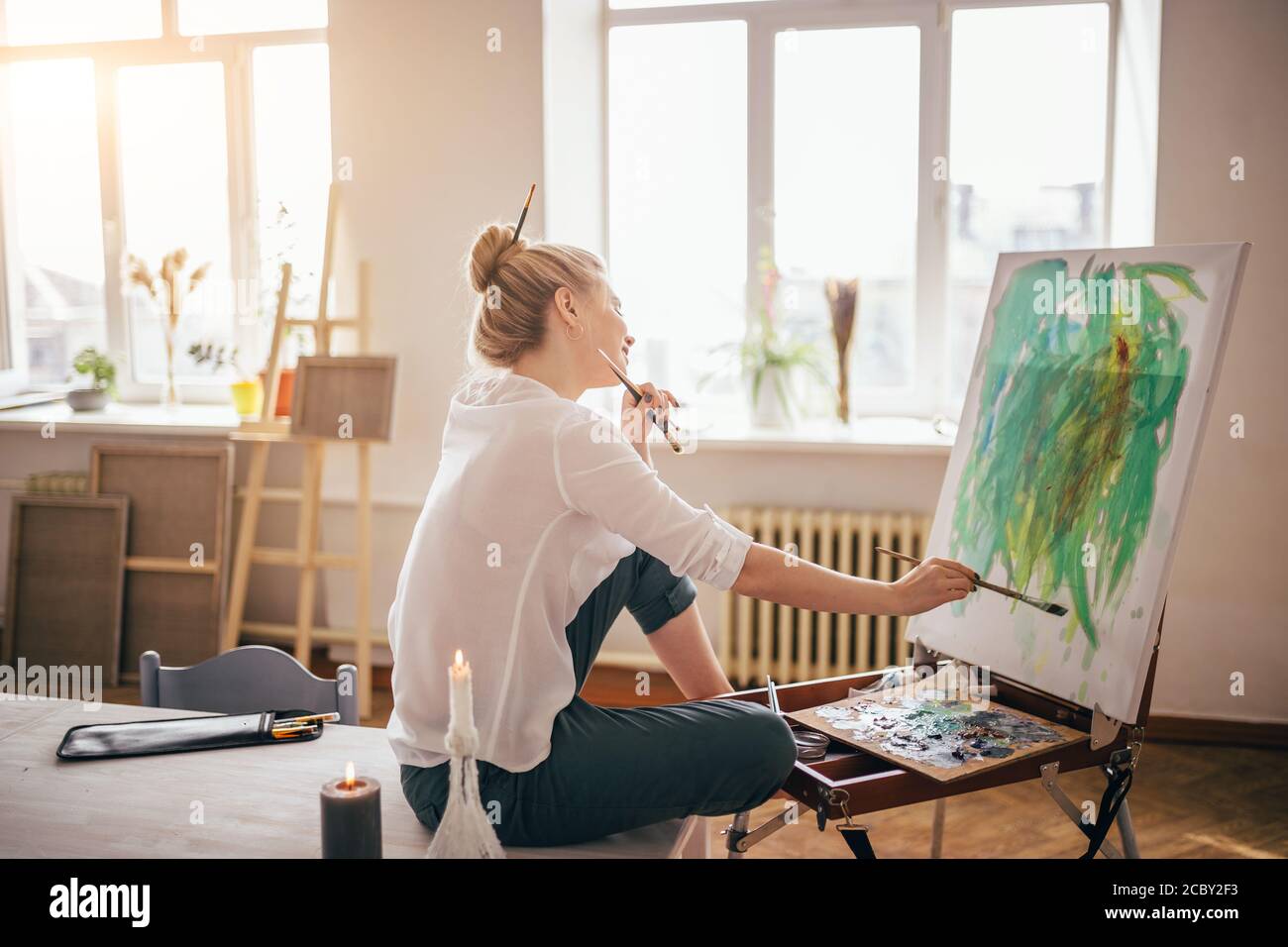 the activity . skill of creating pictures by using paints. girl ...