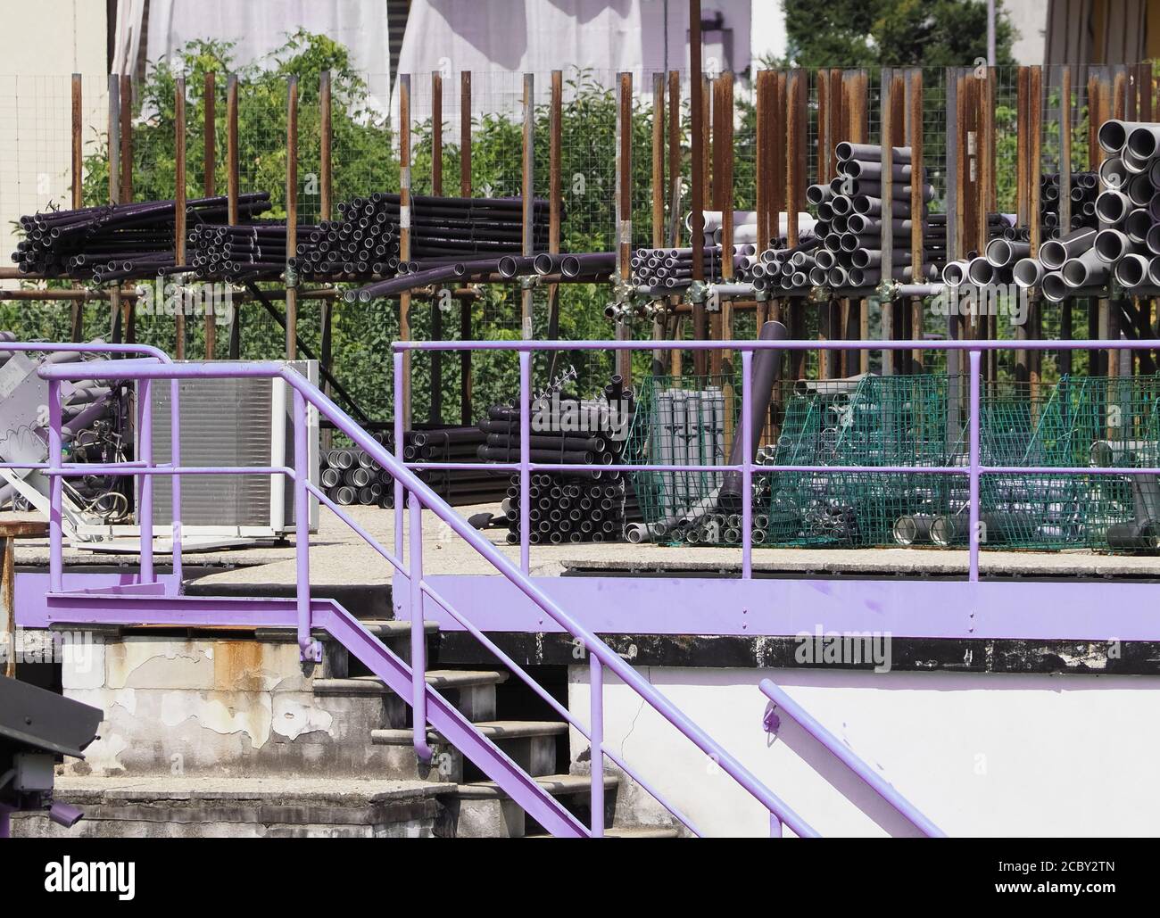 plastic and steel tubes and pipes storage Stock Photo - Alamy