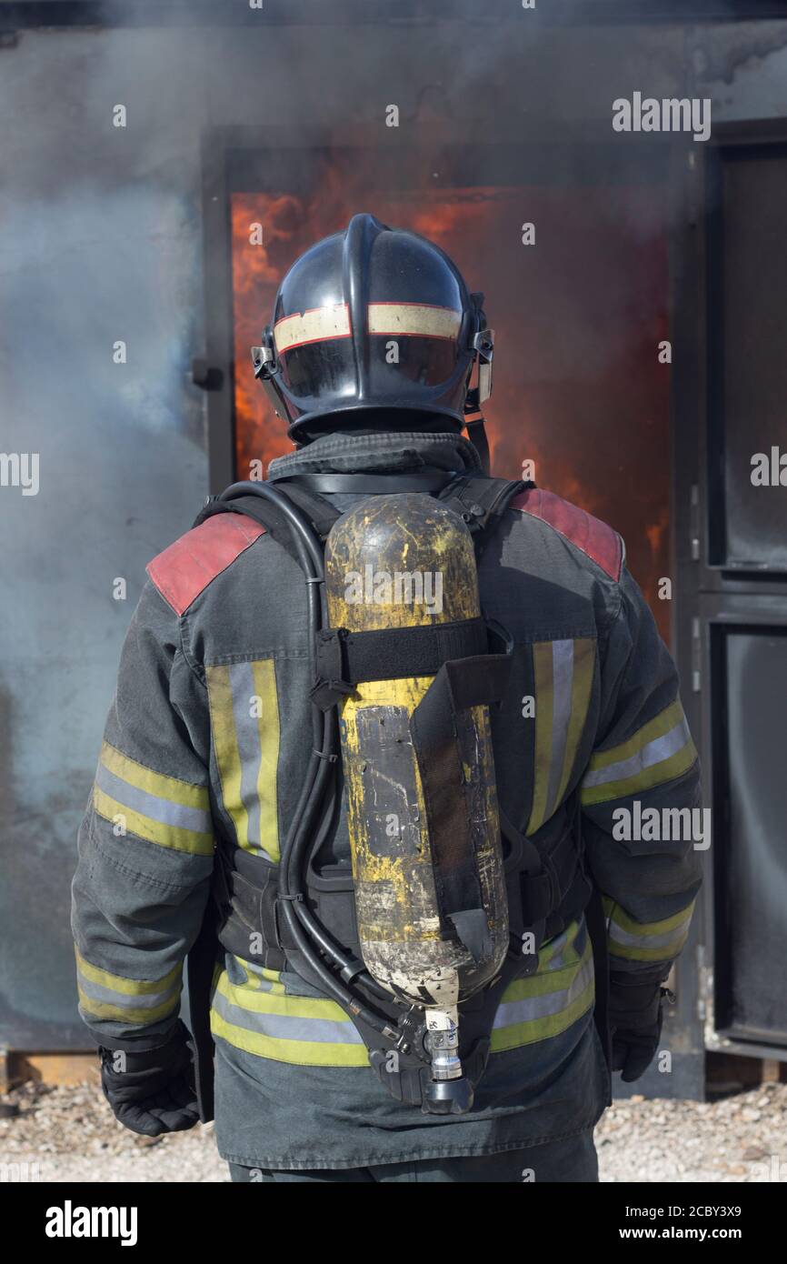 Firefighter putting out fire training station extinguisher backdraft ...