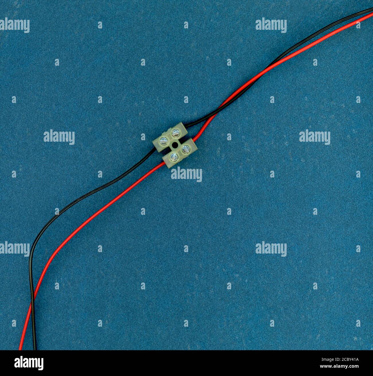 red and black electrical wires joined with paired screw terminal Stock ...