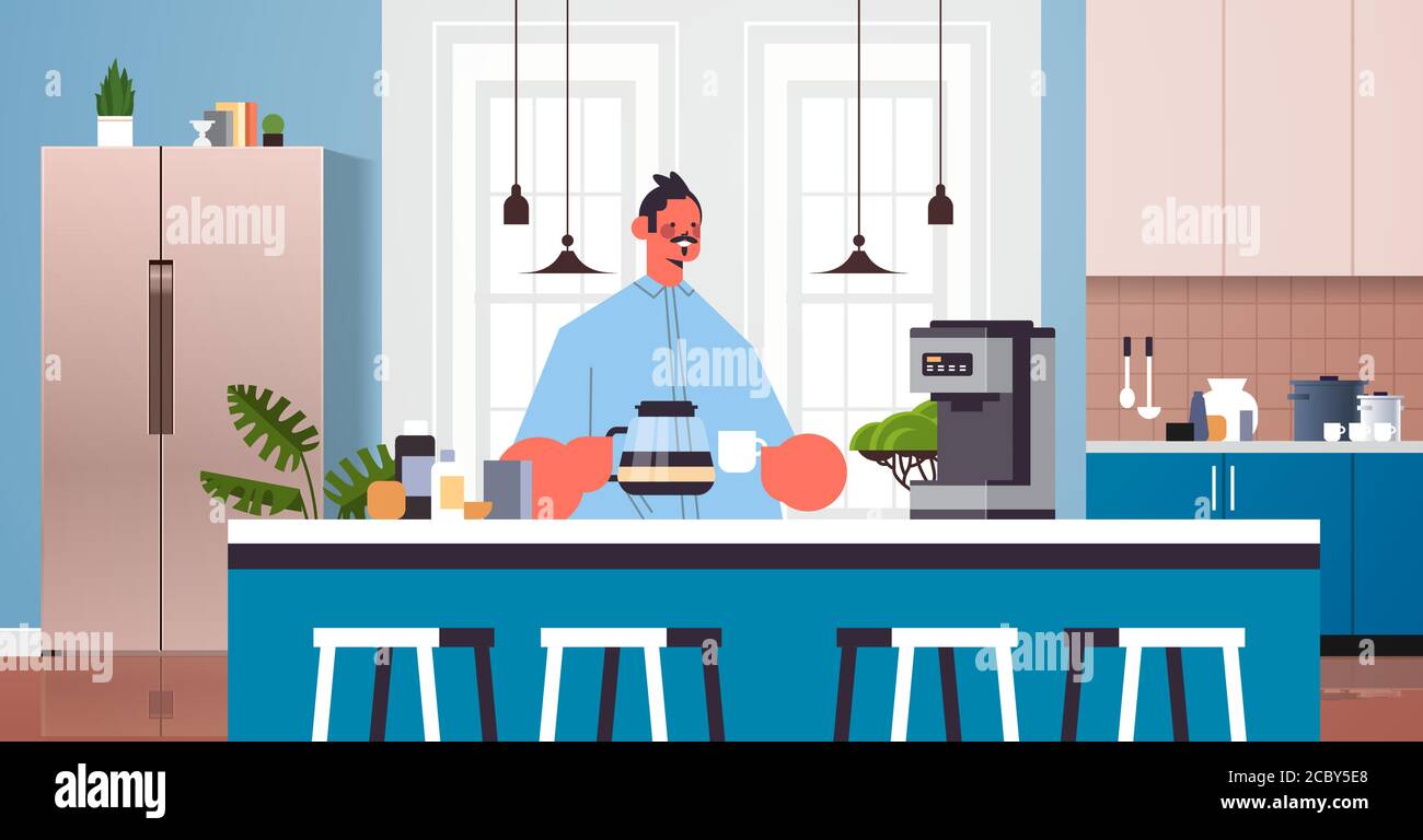 happy man drinking coffee guy relaxing at home cooking concept modern ...