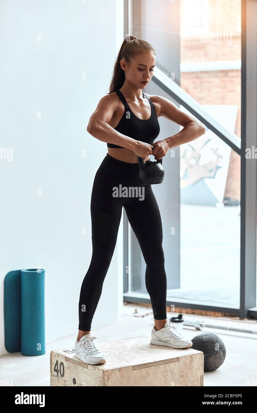 Woman lifting heavy box hi-res stock photography and images - Alamy