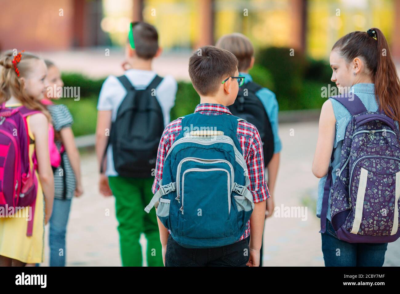 Group of kids going to school together Stock Photo - Alamy