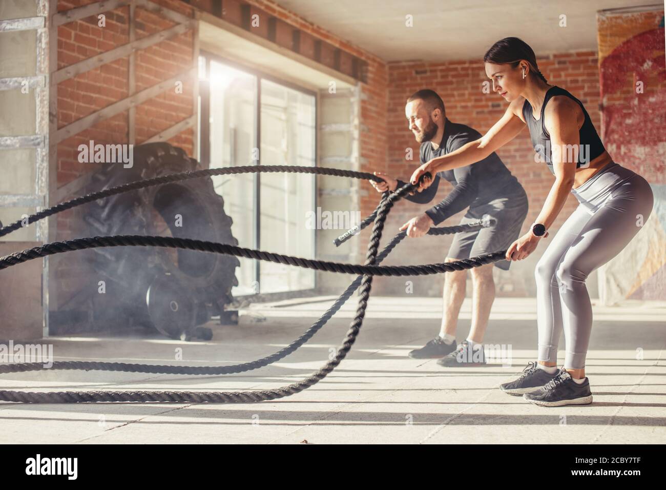 Muscular couple doing ball exercise hi-res stock photography and images ...