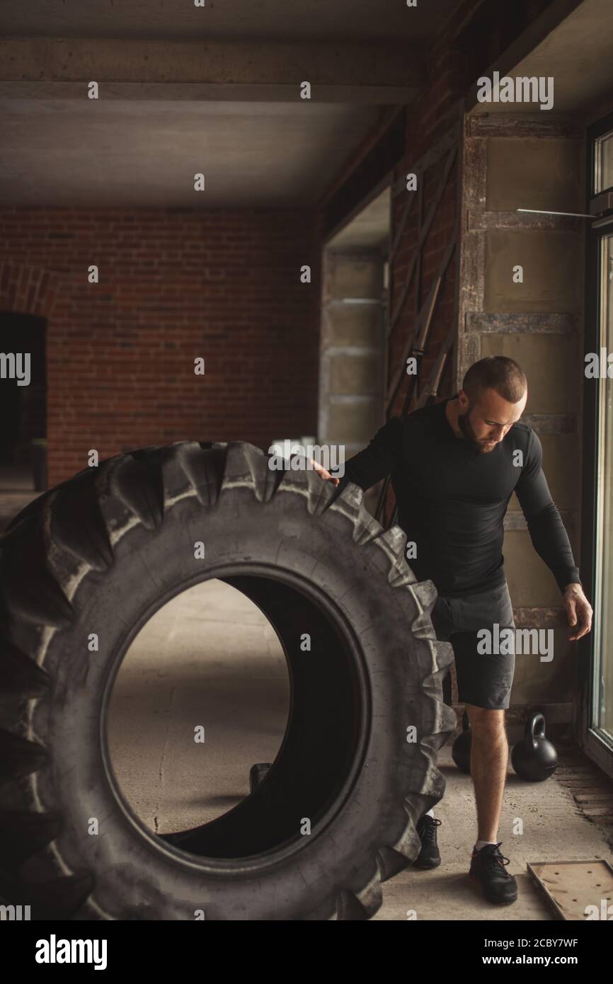 Professional CrossFit trainer explains principles of training with tire ...
