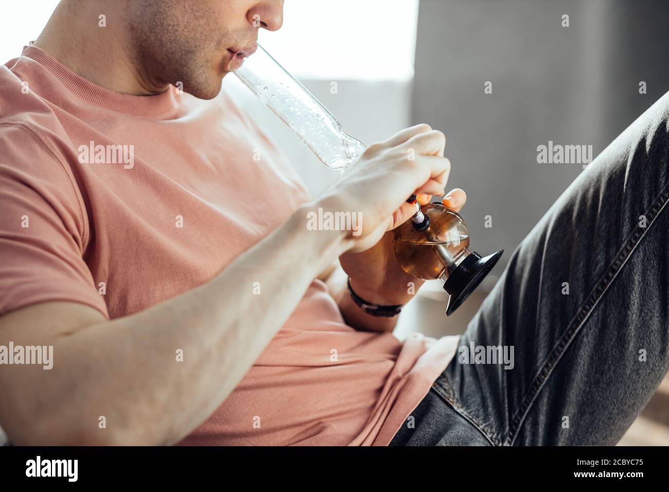 man use bong with marijuana, cannabis thc flower sativa and indica ...