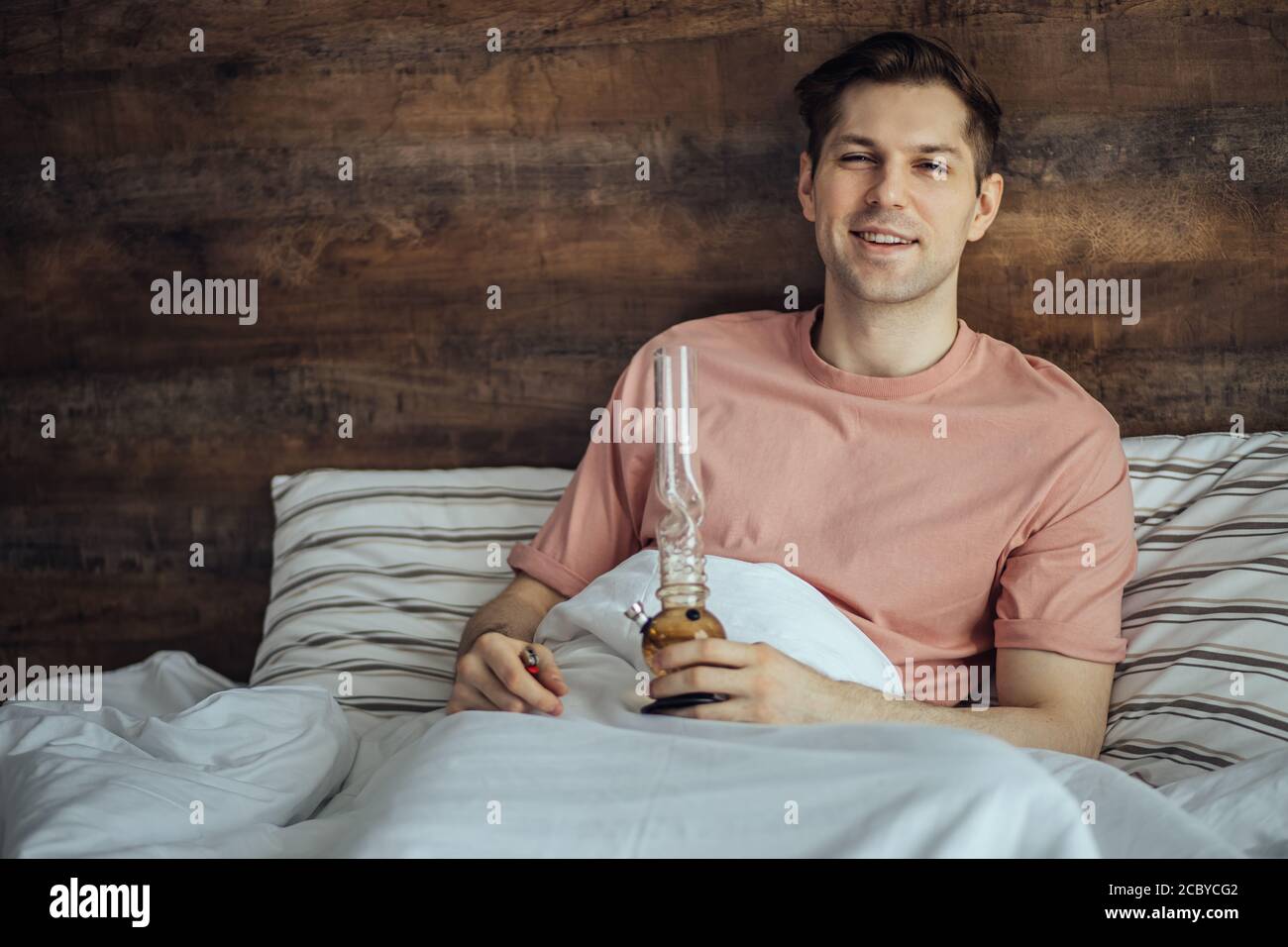 young caucasian man suffering from drug addiction at home, he use ...