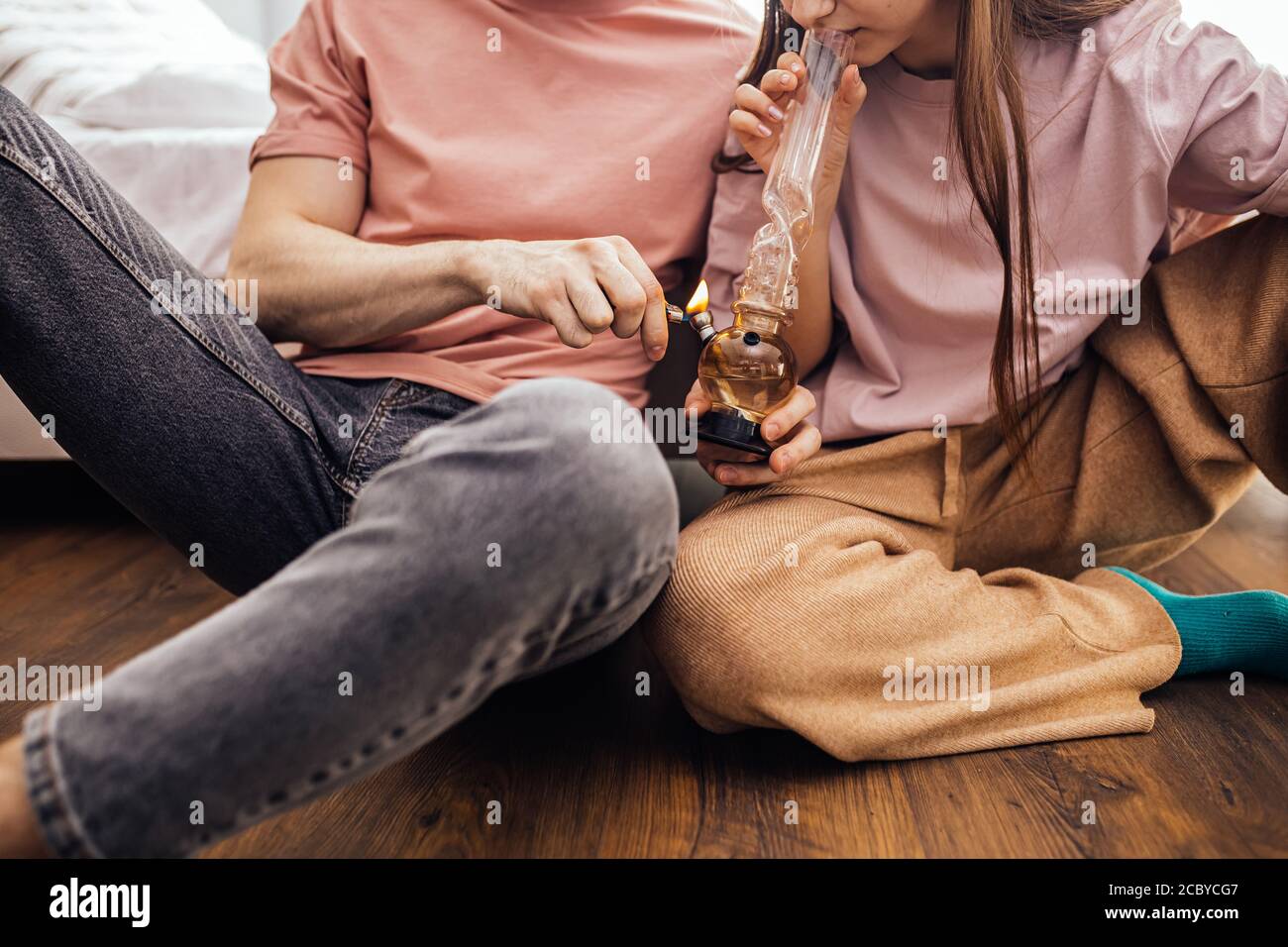 young caucasian man and woman using drugs at home, couple suffer from ...