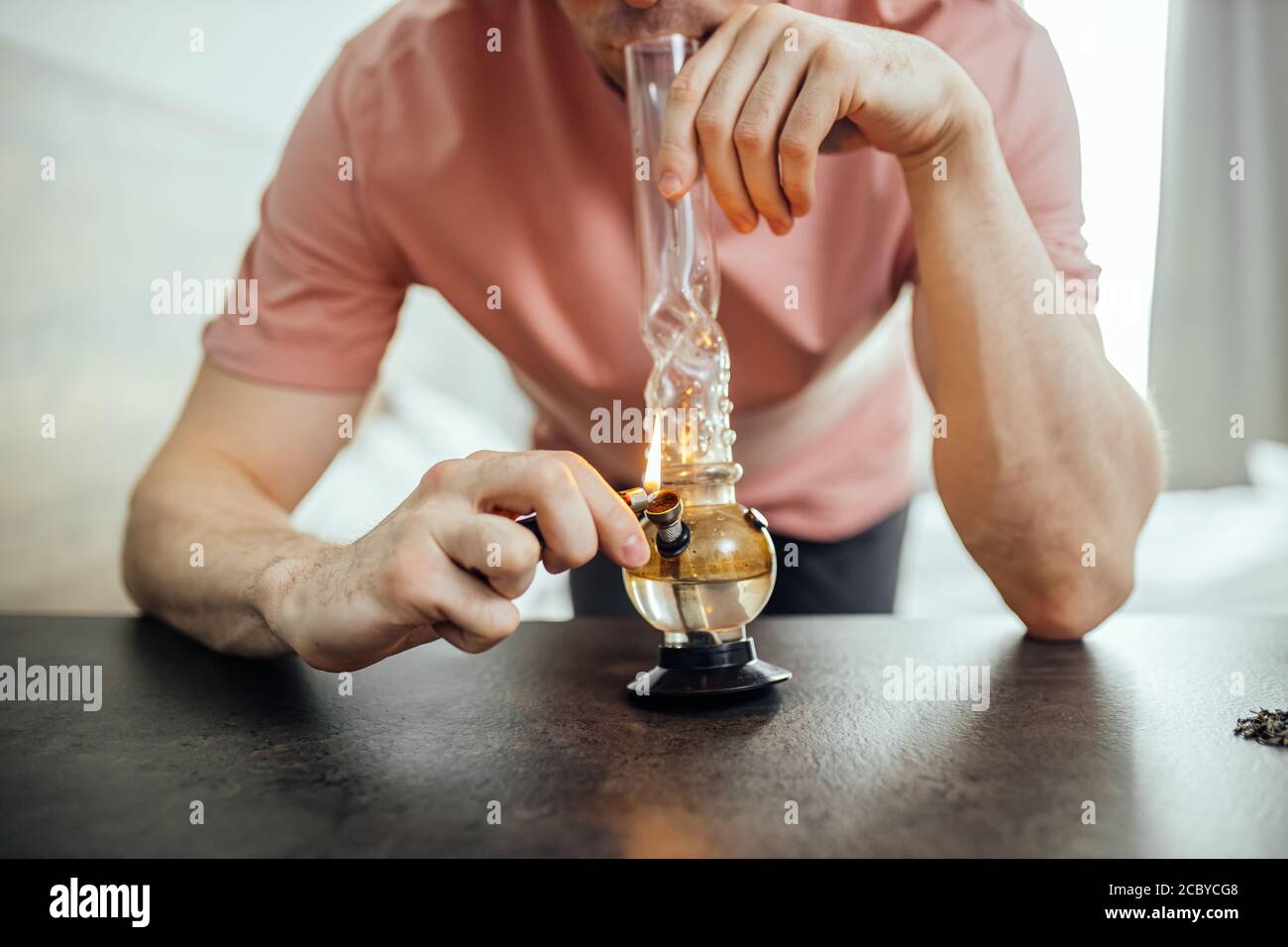 young caucasian man suffering from drug addiction at home, he use ...