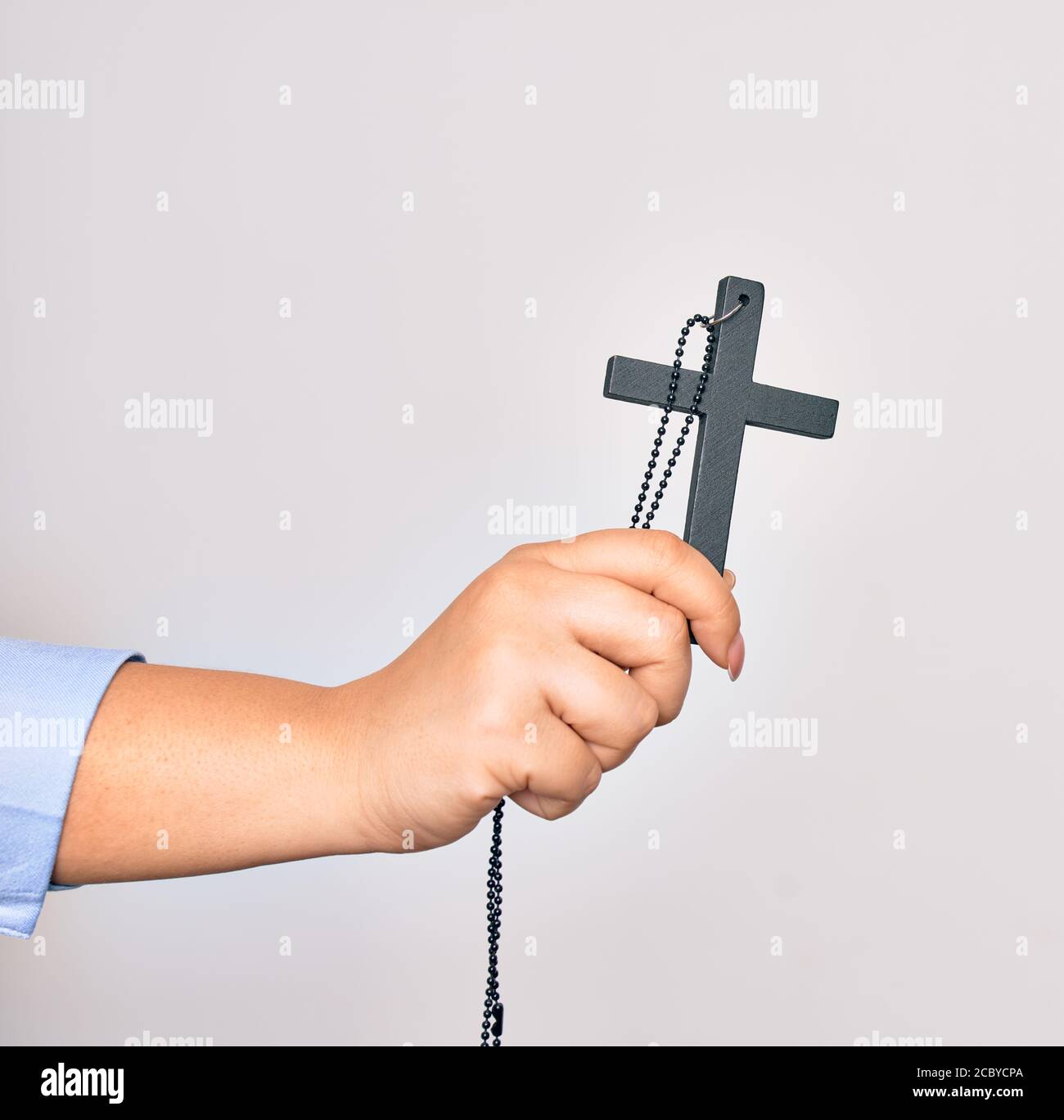 Woman praying over jesus cross hi-res stock photography and images - Alamy
