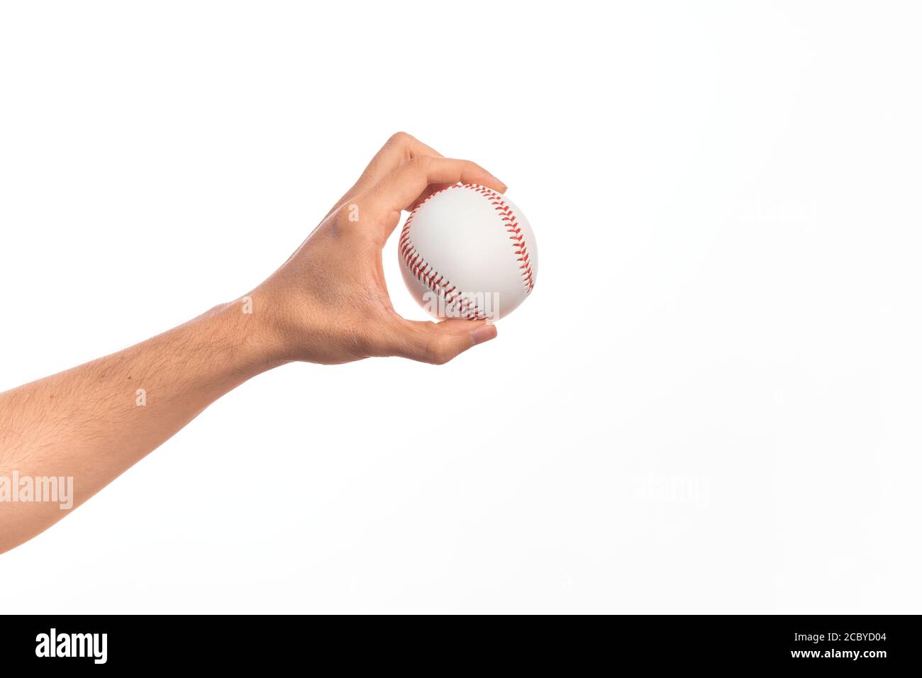 Hand of caucasian young man holding baseball ball over isolated white ...